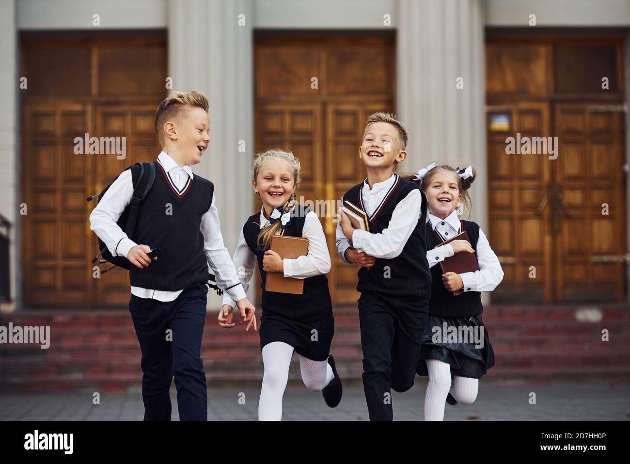 Children running school uniform hi-res stock photography and images - Alamy