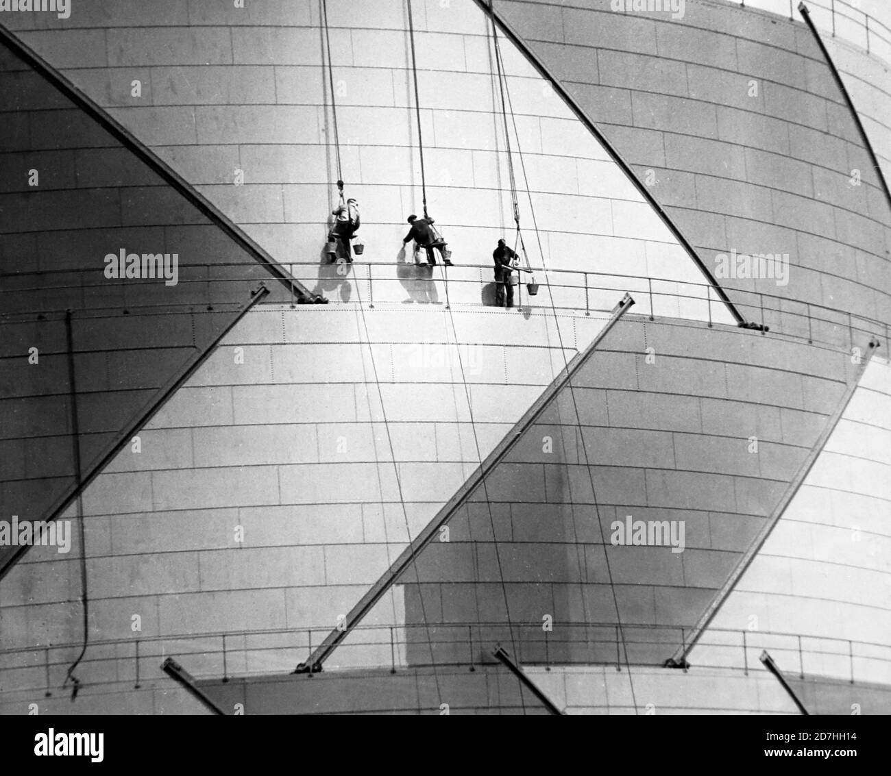 Painting a gasometer probably 1920s Stock Photo - Alamy