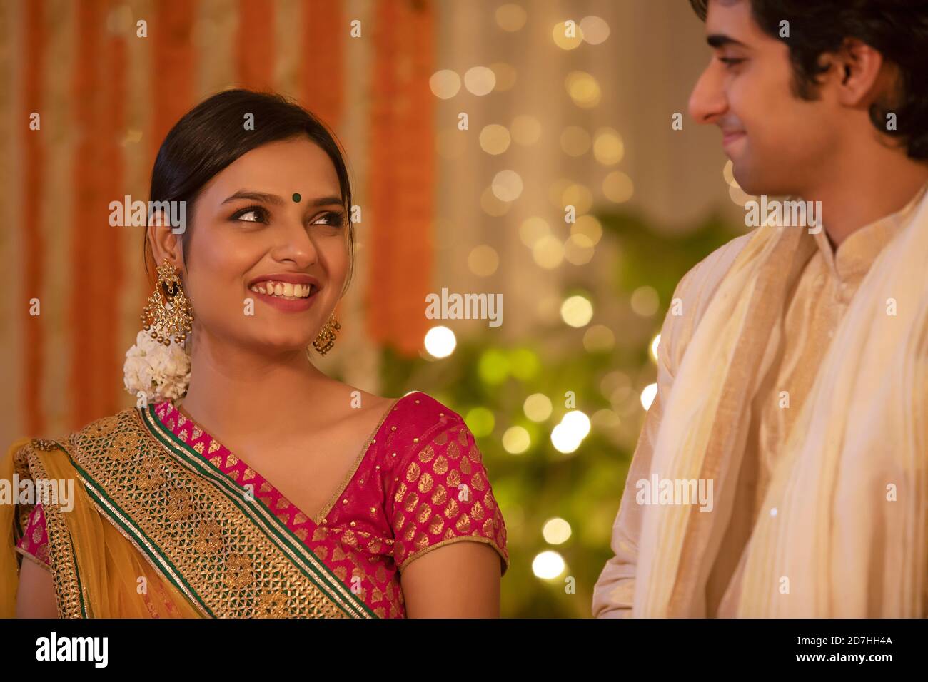 Young girl smiling brightly towards a man Stock Photo - Alamy