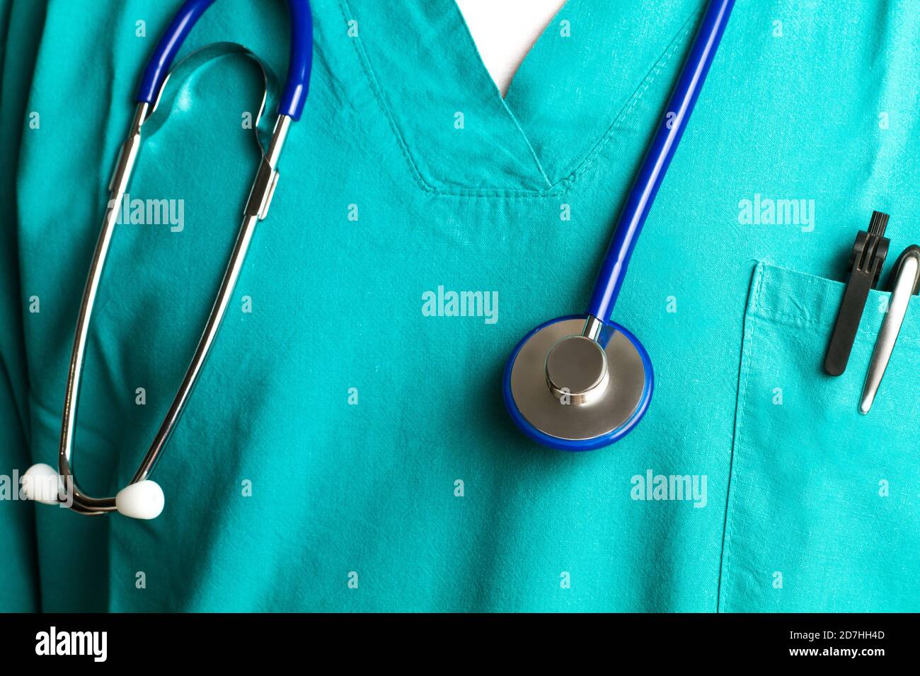 Doctor with a stethoscope hanging from his neck in a close up view ...
