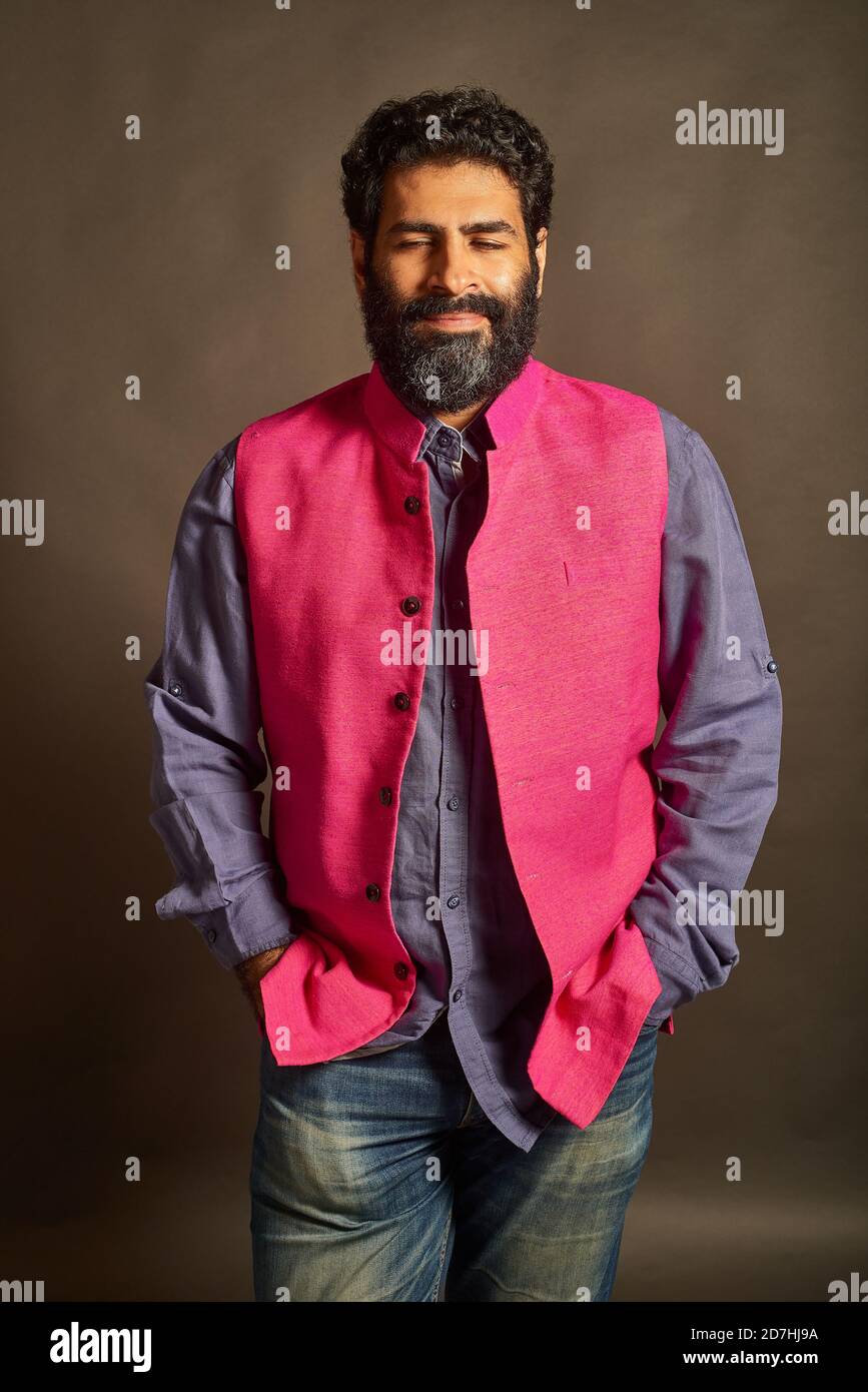 A young Indian man with a typical 'artist' and 'intellectual' look ...