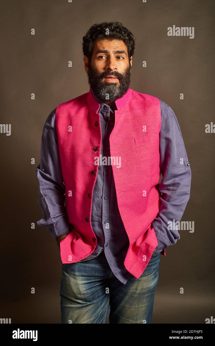 A young Indian man with a typical 'artist' and 'intellectual' look ...