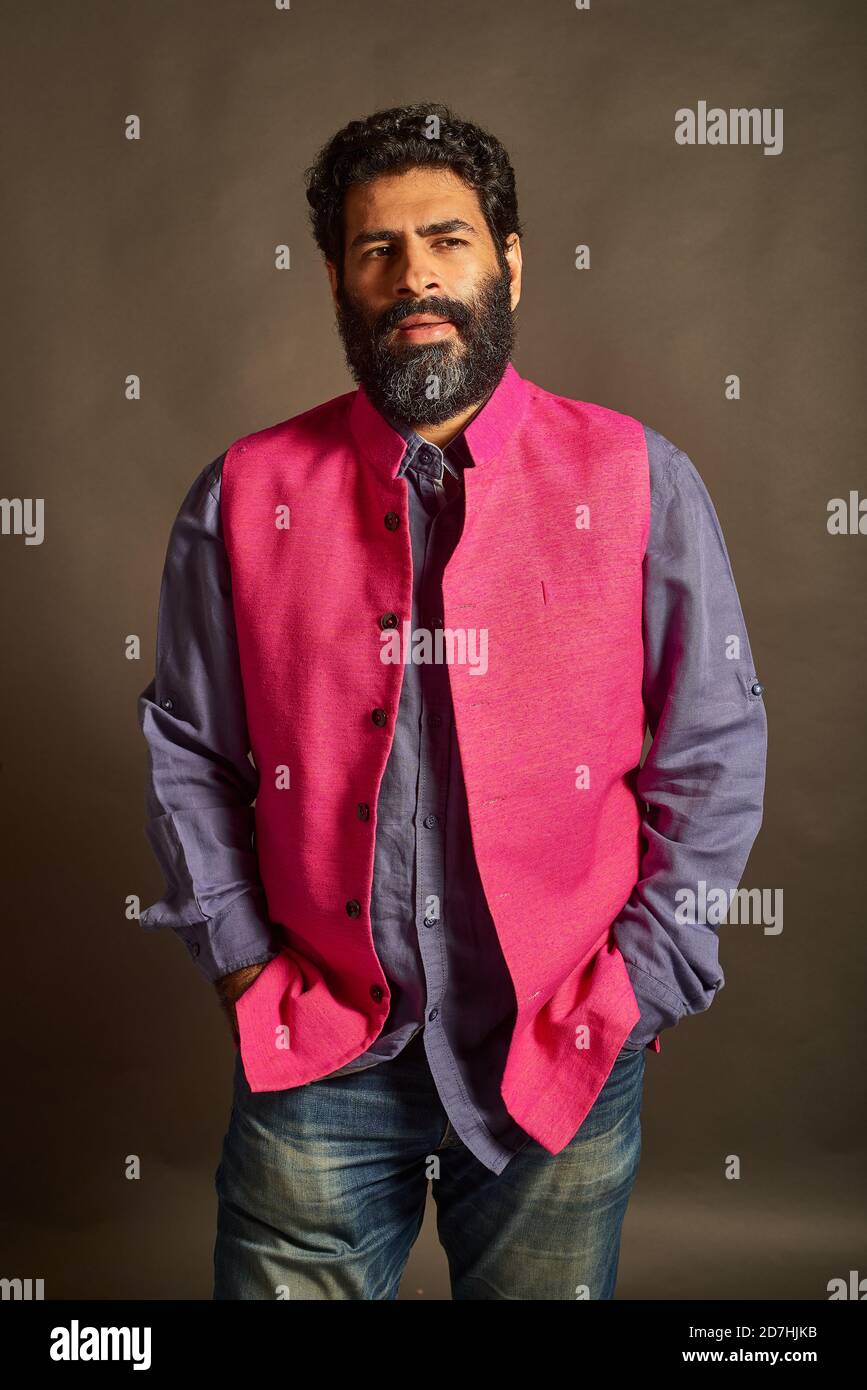 A young Indian man with a typical 'artist' and 'intellectual' look ...