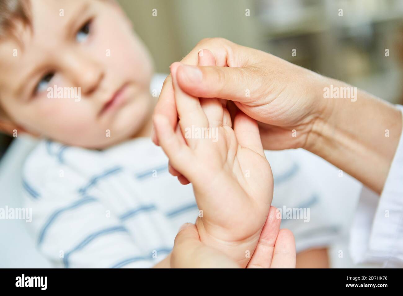 Child undergoing osteopathy or physiotherapy for wrist pain Stock Photo ...
