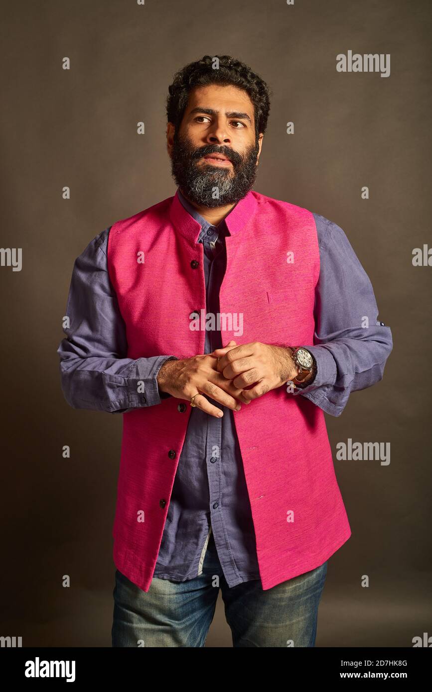 A young Indian man with a typical 'artist' and 'intellectual' look ...