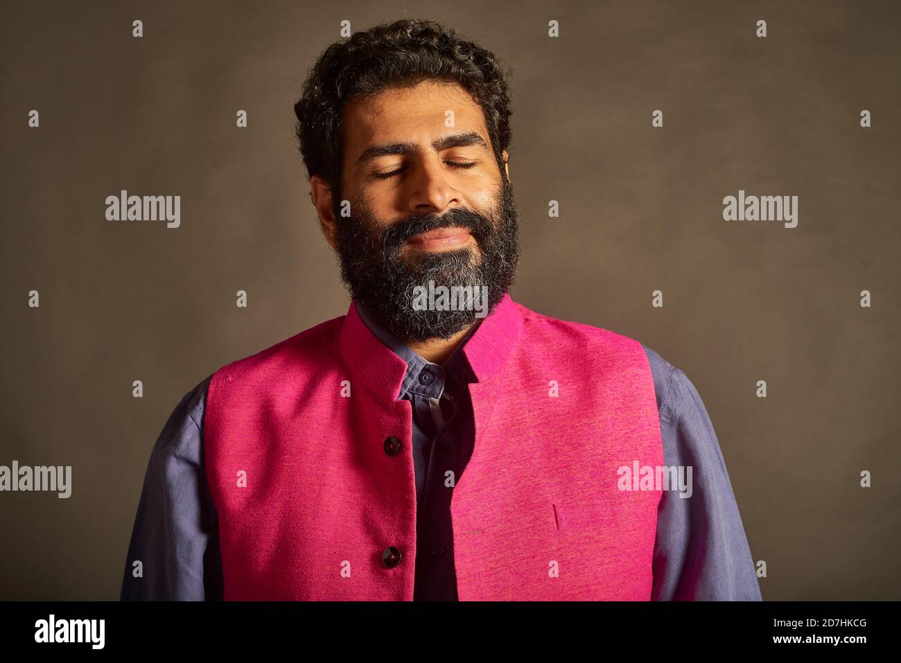 A young Indian man with a typical 'artist' and 'intellectual' look ...