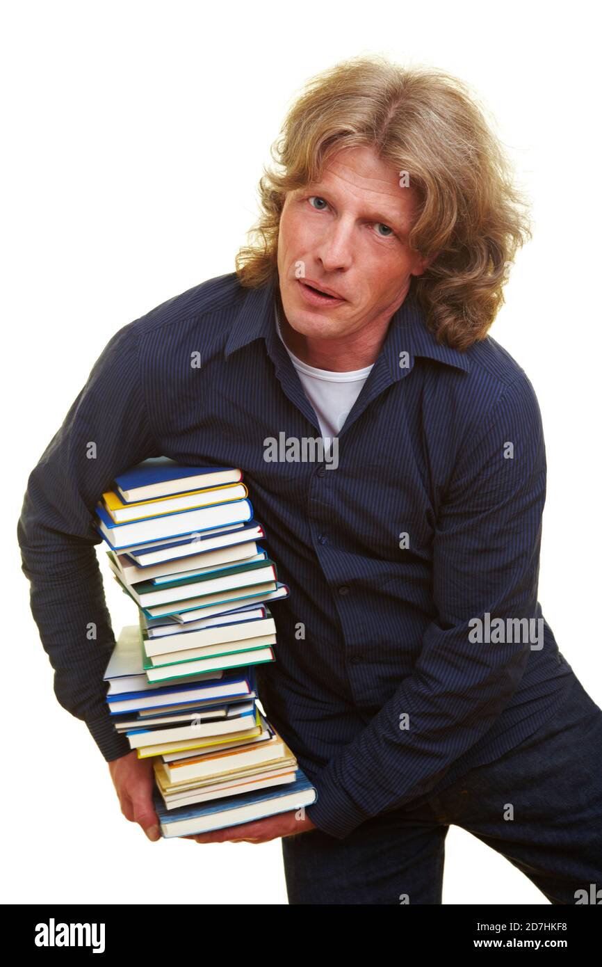 Man carries a heavy stack of books Stock Photo - Alamy
