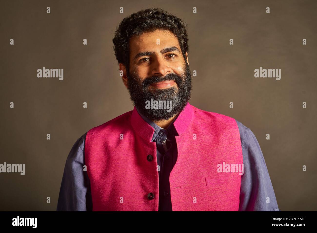 A young Indian man with a typical 'artist' and 'intellectual' look ...