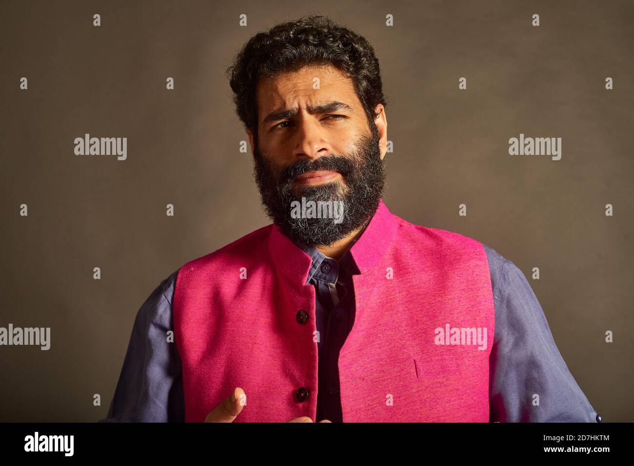 A young Indian man with a typical 'artist' and 'intellectual' look ...