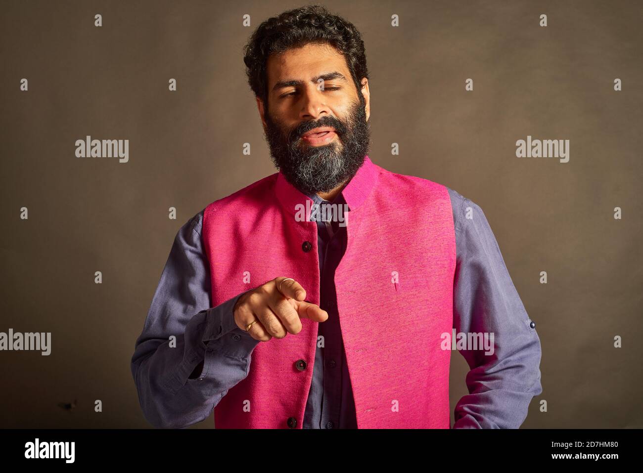 A young Indian man with a typical 'artist' and 'intellectual' look ...