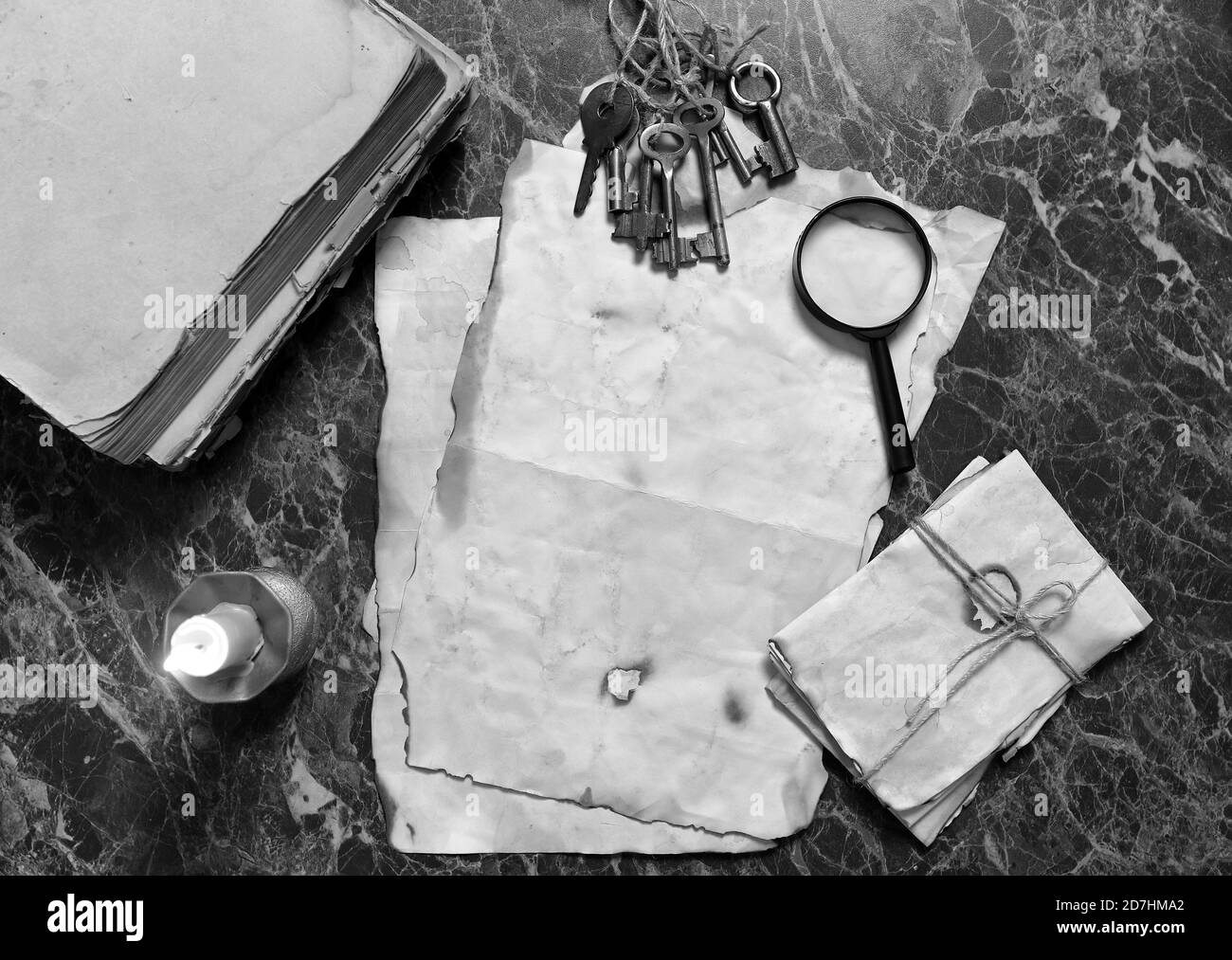 papers and book on detective work table with tools Stock Photo - Alamy