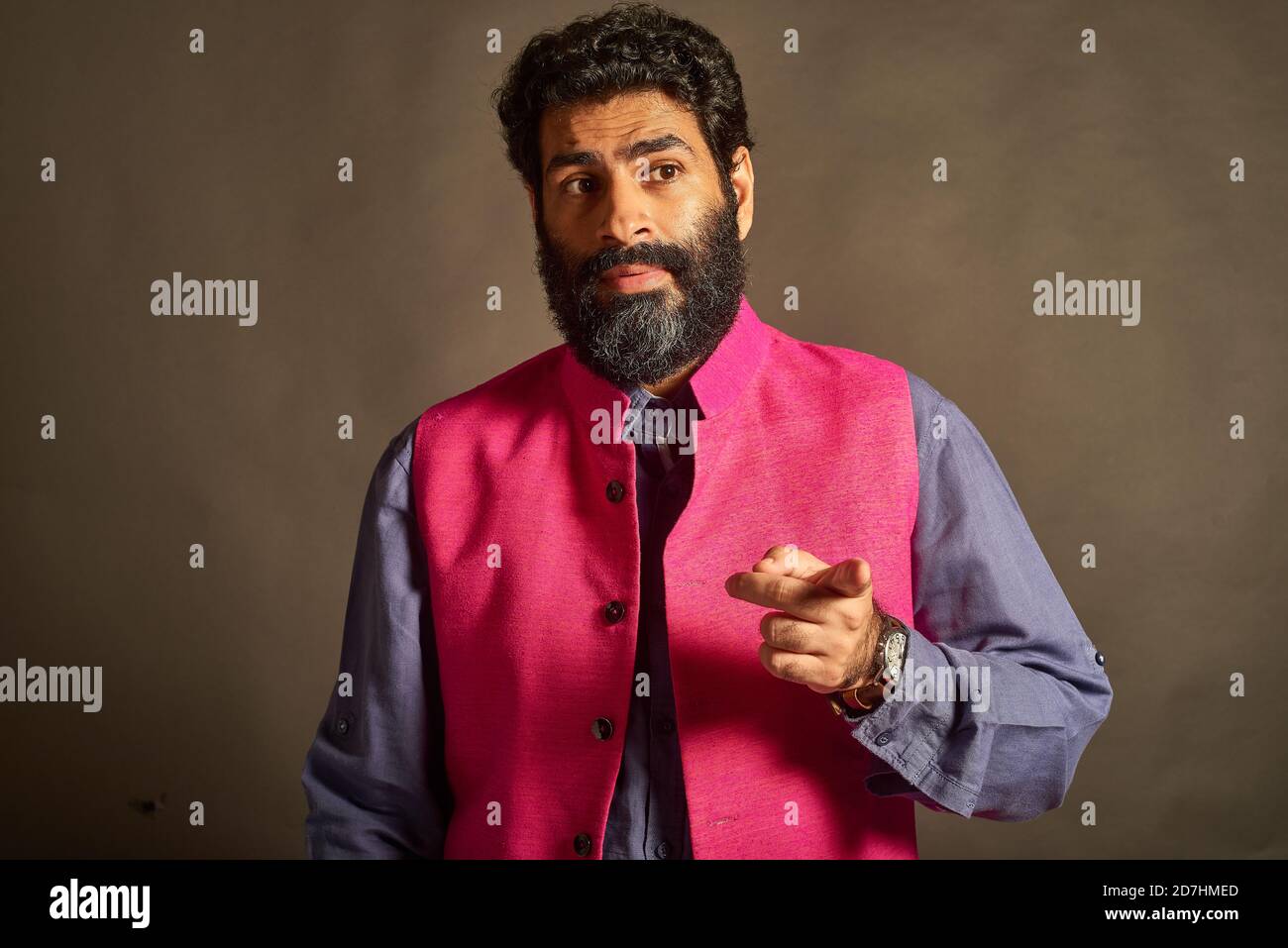 A young Indian man with a typical 'artist' and 'intellectual' look ...