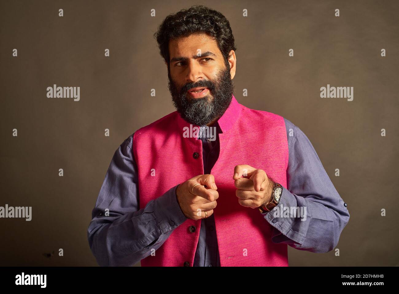 A young Indian man with a typical 'artist' and 'intellectual' look ...