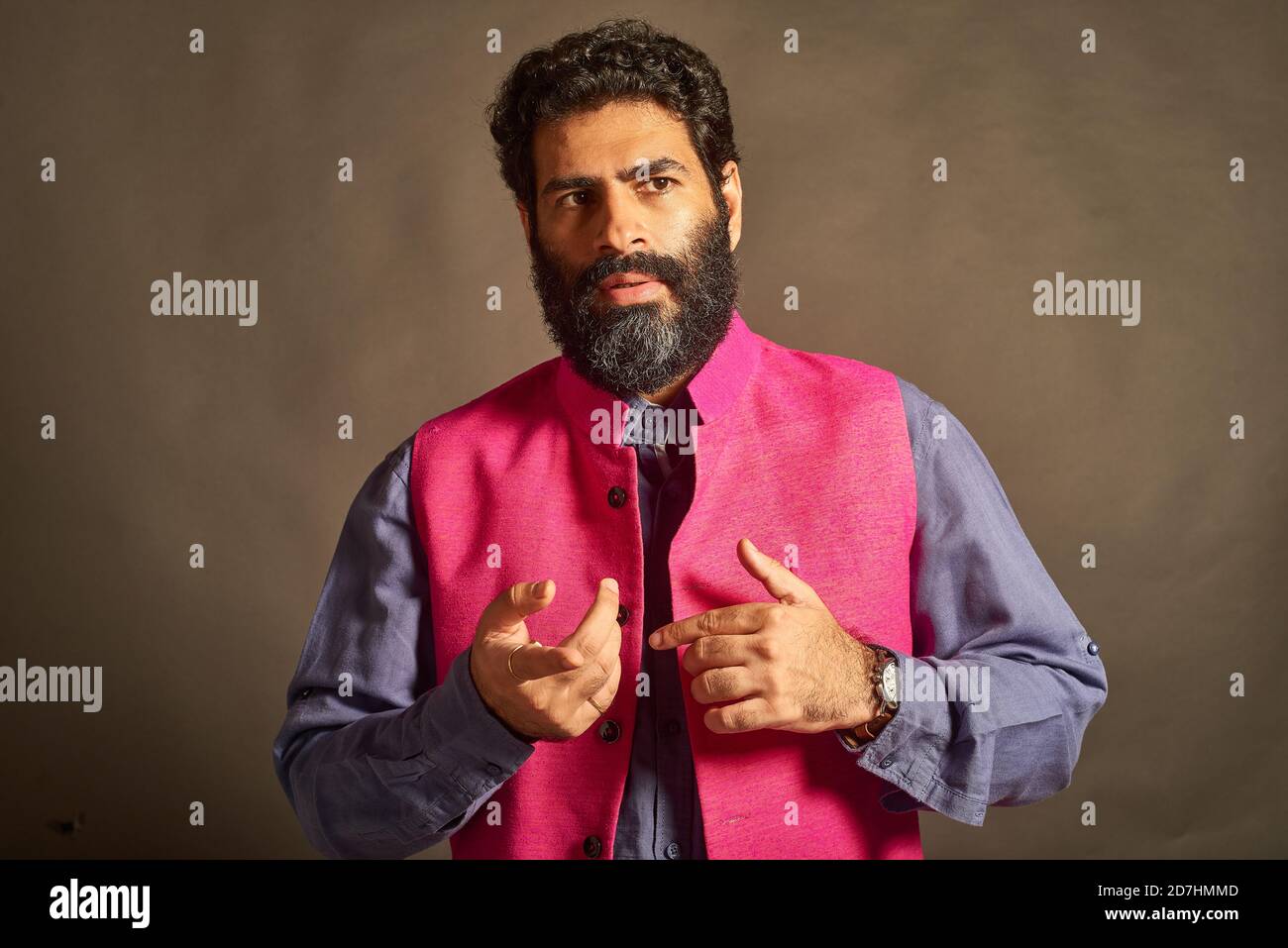 A young Indian man with a typical 'artist' and 'intellectual' look ...