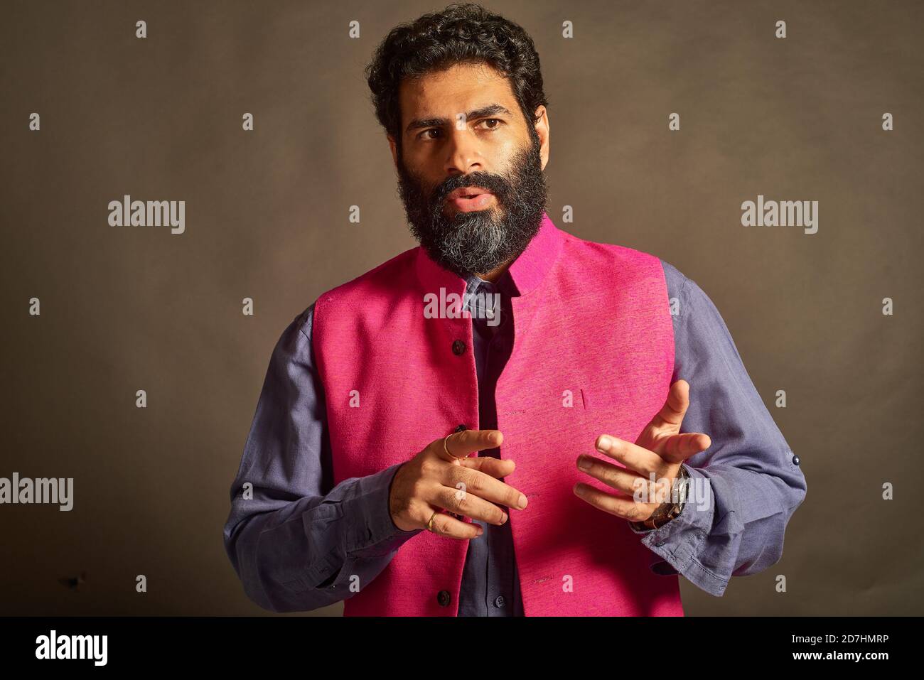 A young Indian man with a typical 'artist' and 'intellectual' look ...