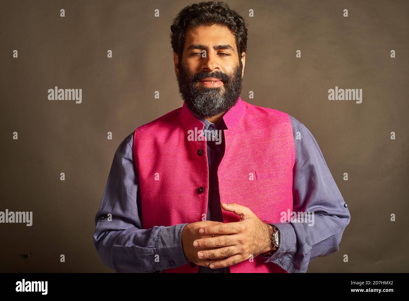 A young Indian man with a typical 'artist' and 'intellectual' look ...