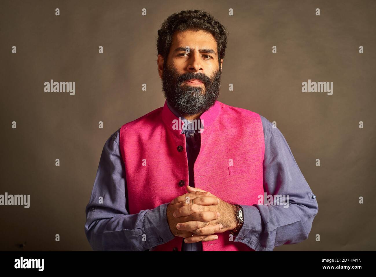 A young Indian man with a typical 'artist' and 'intellectual' look ...