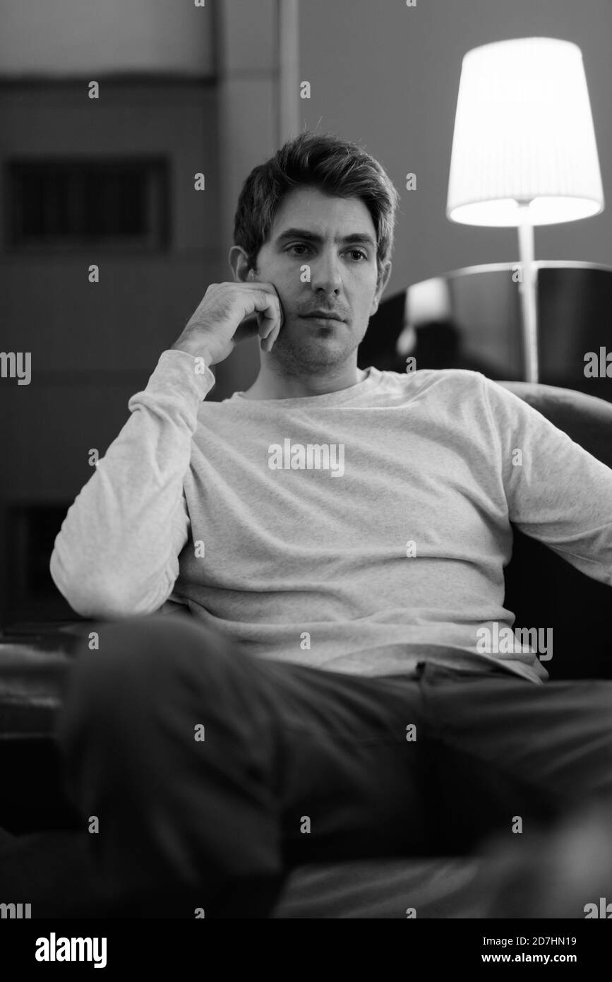 Portrait of handsome man relaxing at the mall Stock Photo - Alamy