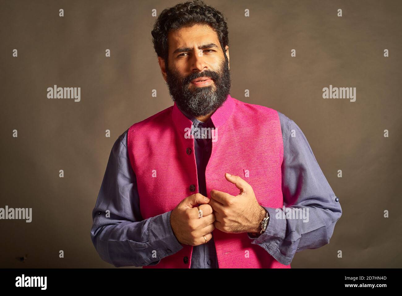 A young Indian man with a typical 'artist' and 'intellectual' look ...