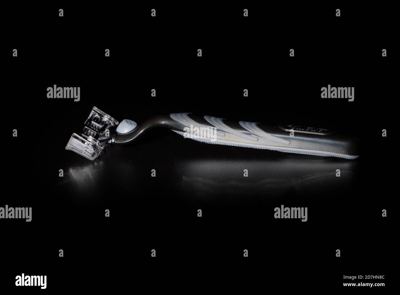 Gillette Mach 3 razor on black background in low key light Stock Photo ...