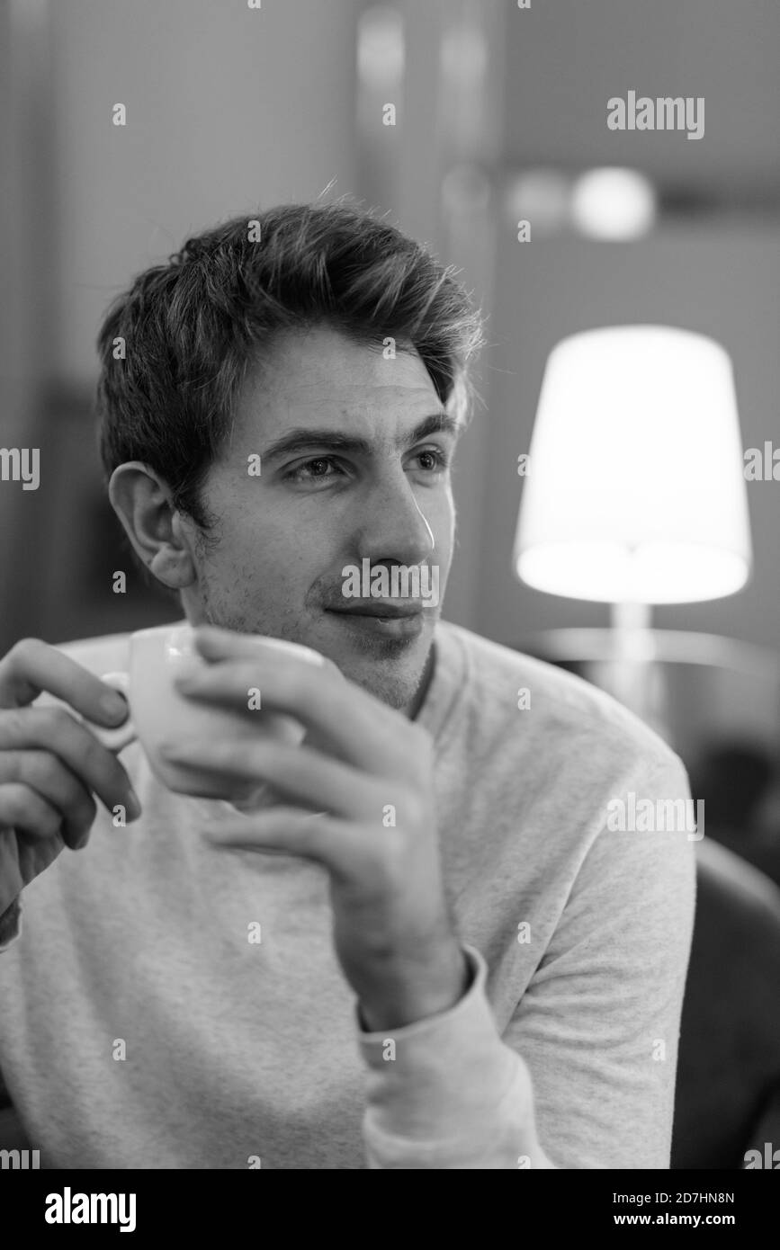 Portrait of handsome man relaxing at the mall Stock Photo - Alamy