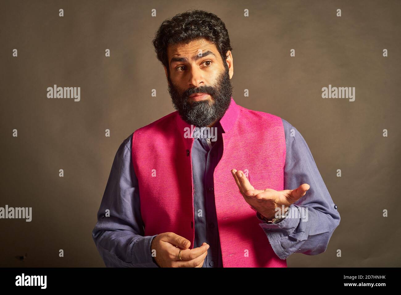 A young Indian man with a typical 'artist' and 'intellectual' look ...