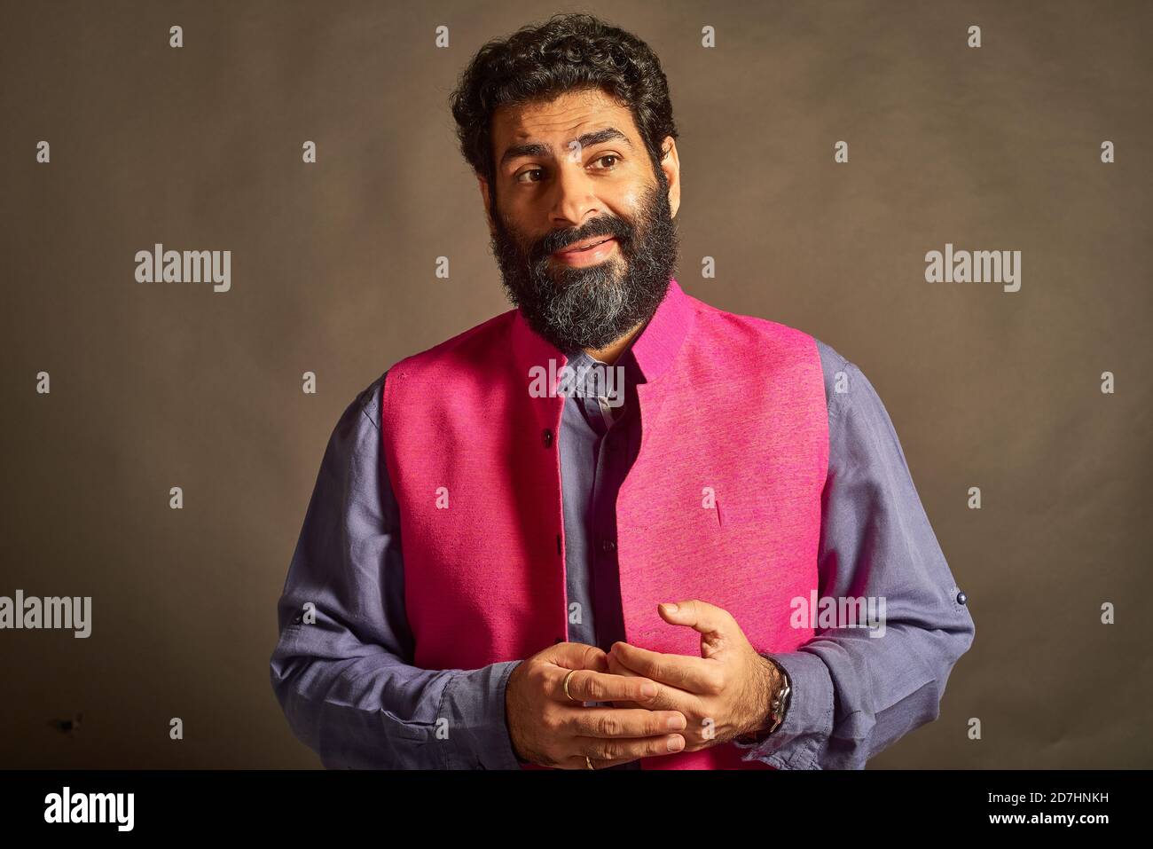 A young Indian man with a typical 'artist' and 'intellectual' look ...