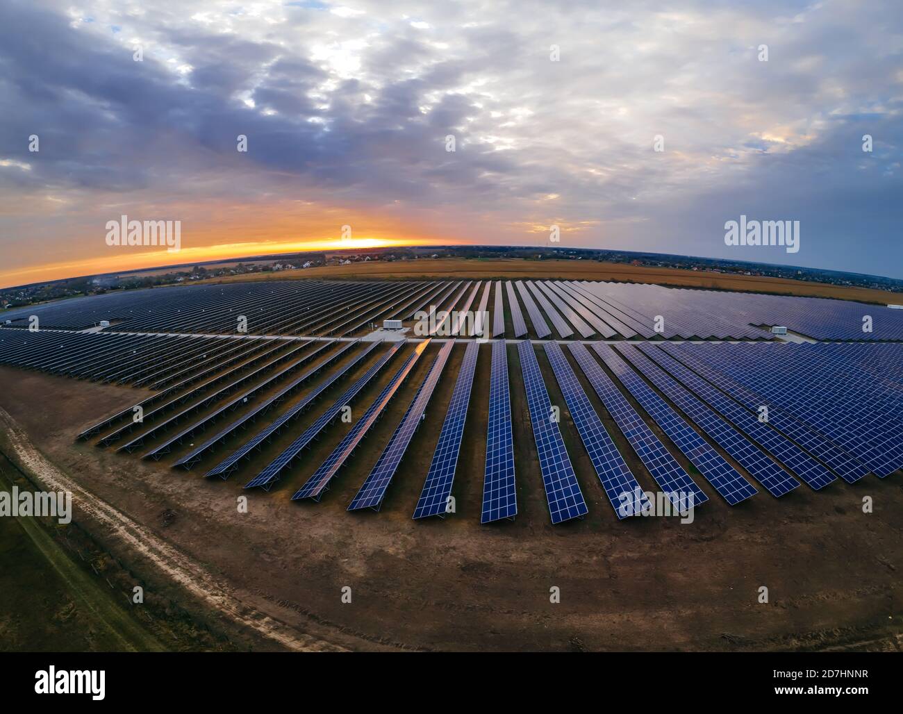 Aerial panorama view of large solar panels at a solar farm at bright ...
