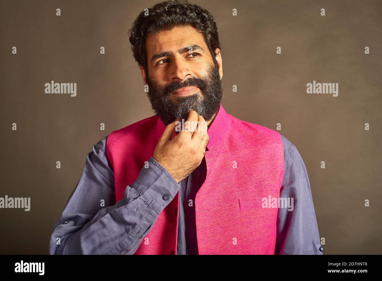 A young Indian man with a typical 'artist' and 'intellectual' look ...