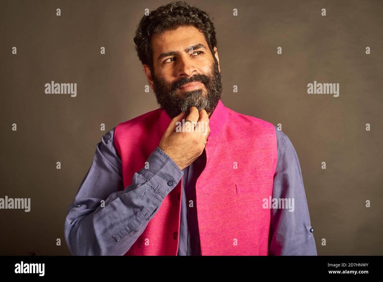 A young Indian man with a typical 'artist' and 'intellectual' look ...