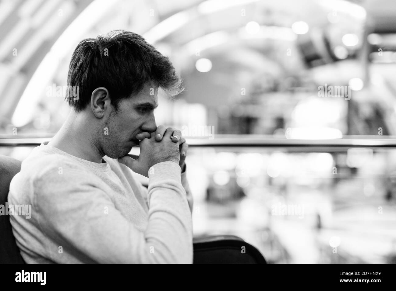 Portrait of handsome man relaxing at the mall Stock Photo - Alamy