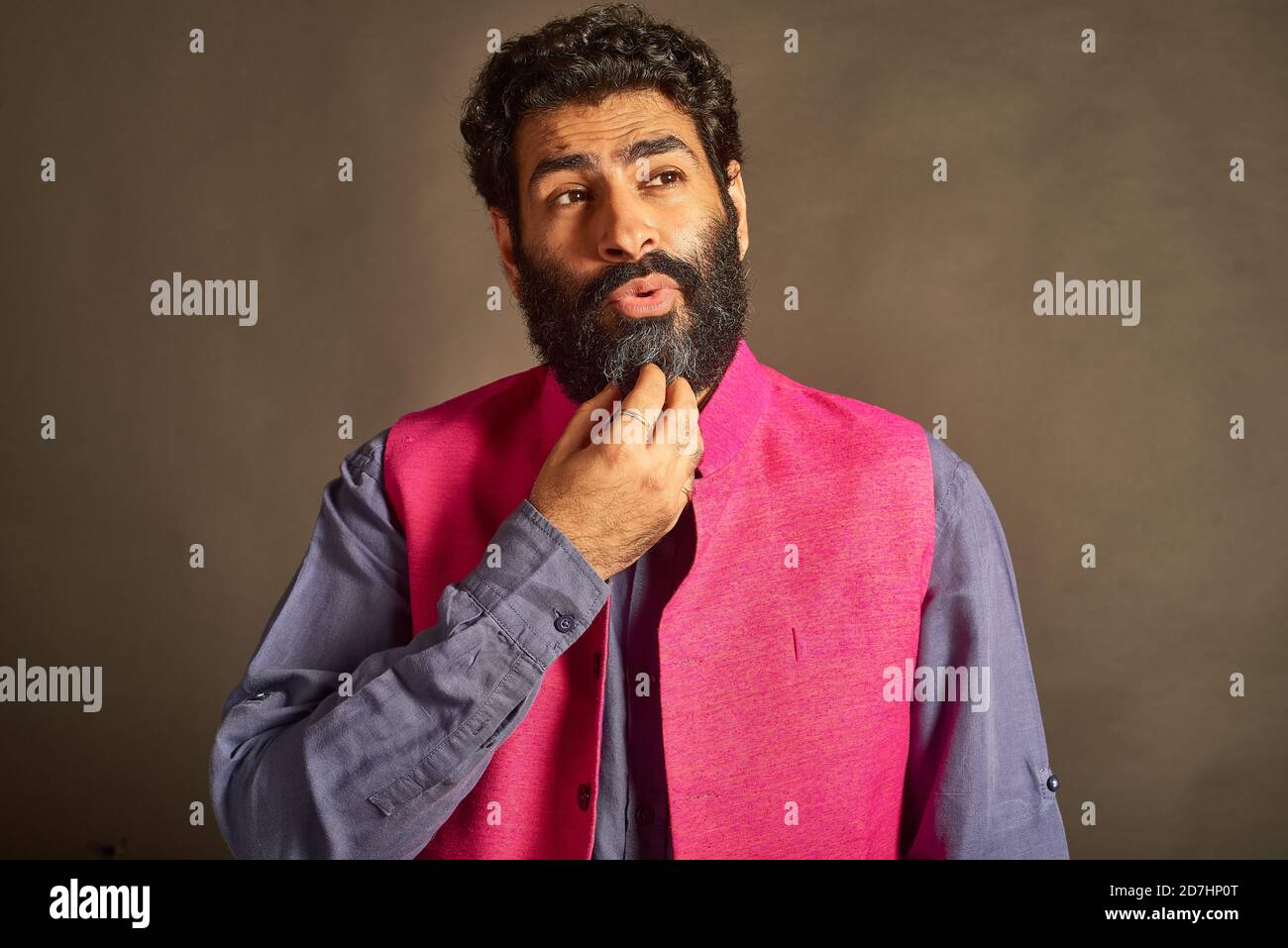 A young Indian man with a typical 'artist' and 'intellectual' look ...