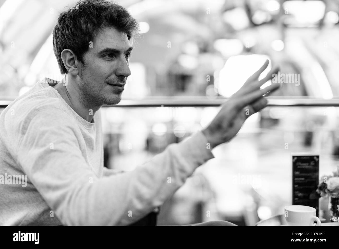 Portrait of handsome man relaxing at the mall Stock Photo - Alamy