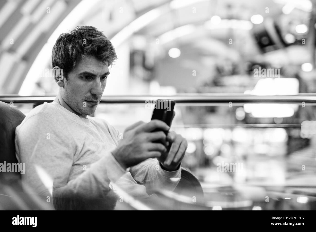 Portrait of handsome man relaxing at the mall Stock Photo - Alamy