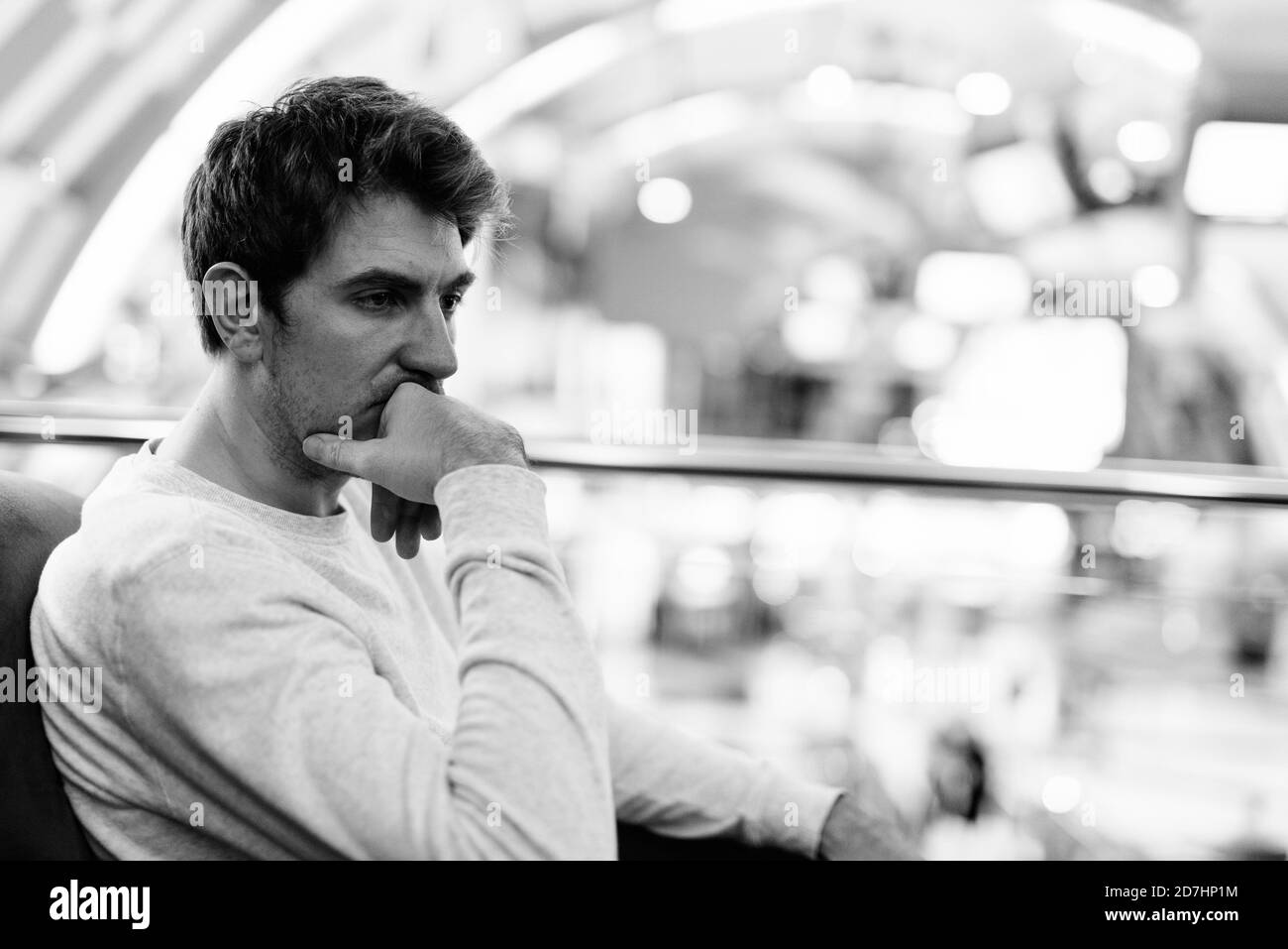 Portrait of handsome man relaxing at the mall Stock Photo - Alamy
