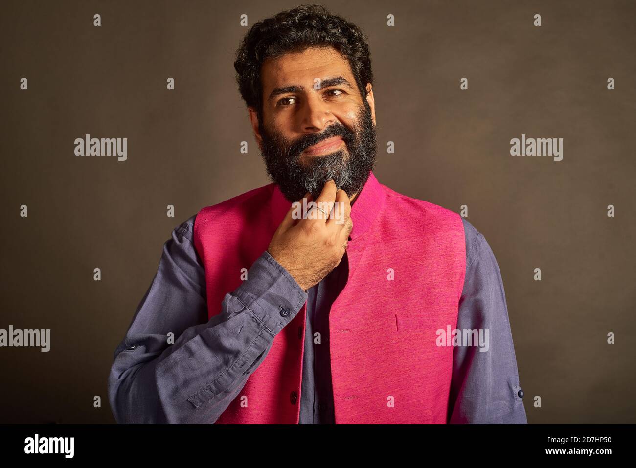 A young Indian man with a typical 'artist' and 'intellectual' look ...