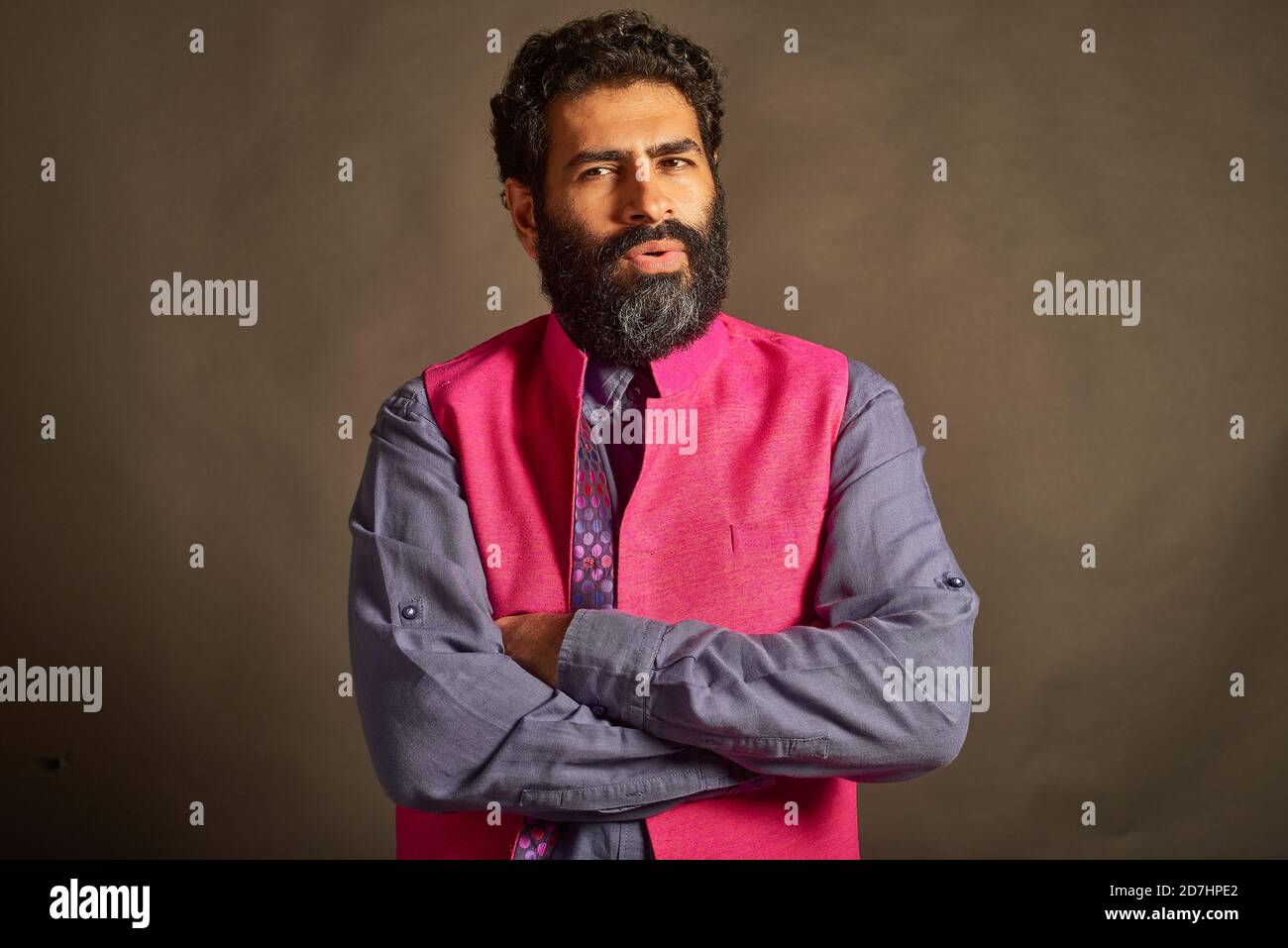 A young Indian man with a typical 'artist' and 'intellectual' look, in ...