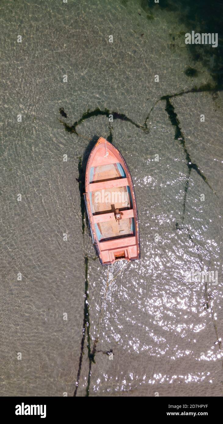 Aerial Top Down View Of Old Wooden Fishing Boat Docked in the Sea ...