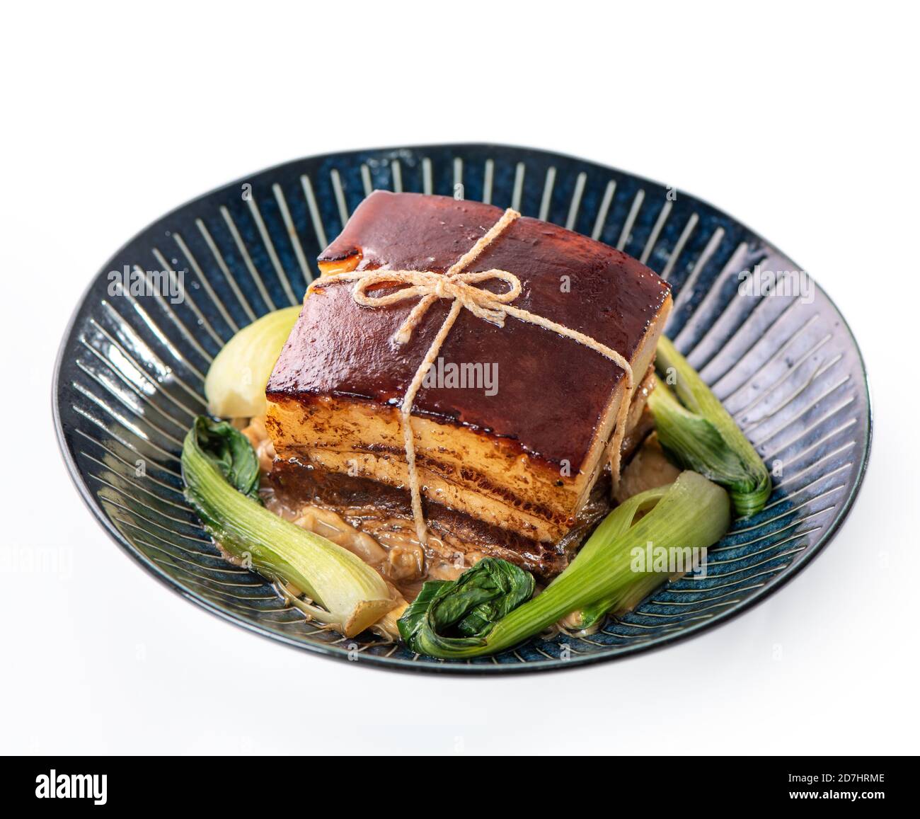 Isolated Dong Po Rou (Dongpo pork meat) in a beautiful plate with green ...