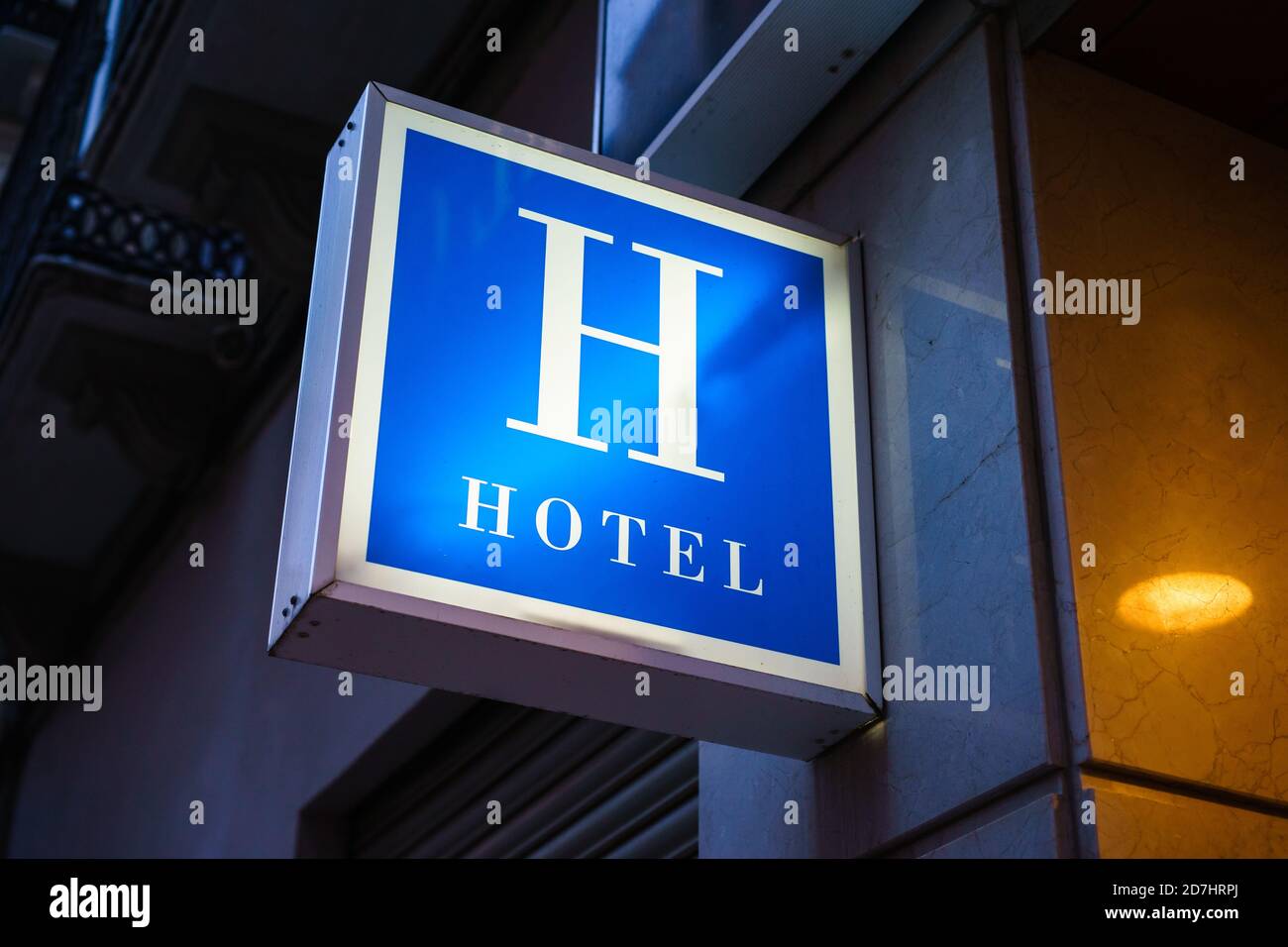 Blue hotel sign on wall Stock Photo - Alamy