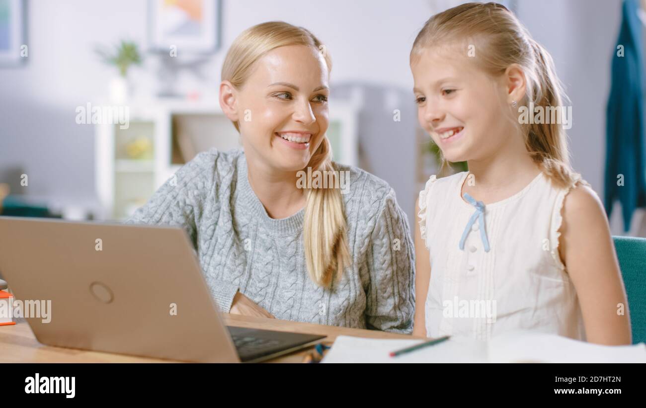 Bright Little Girl Studies with Her Lovely Young Mother Study School ...