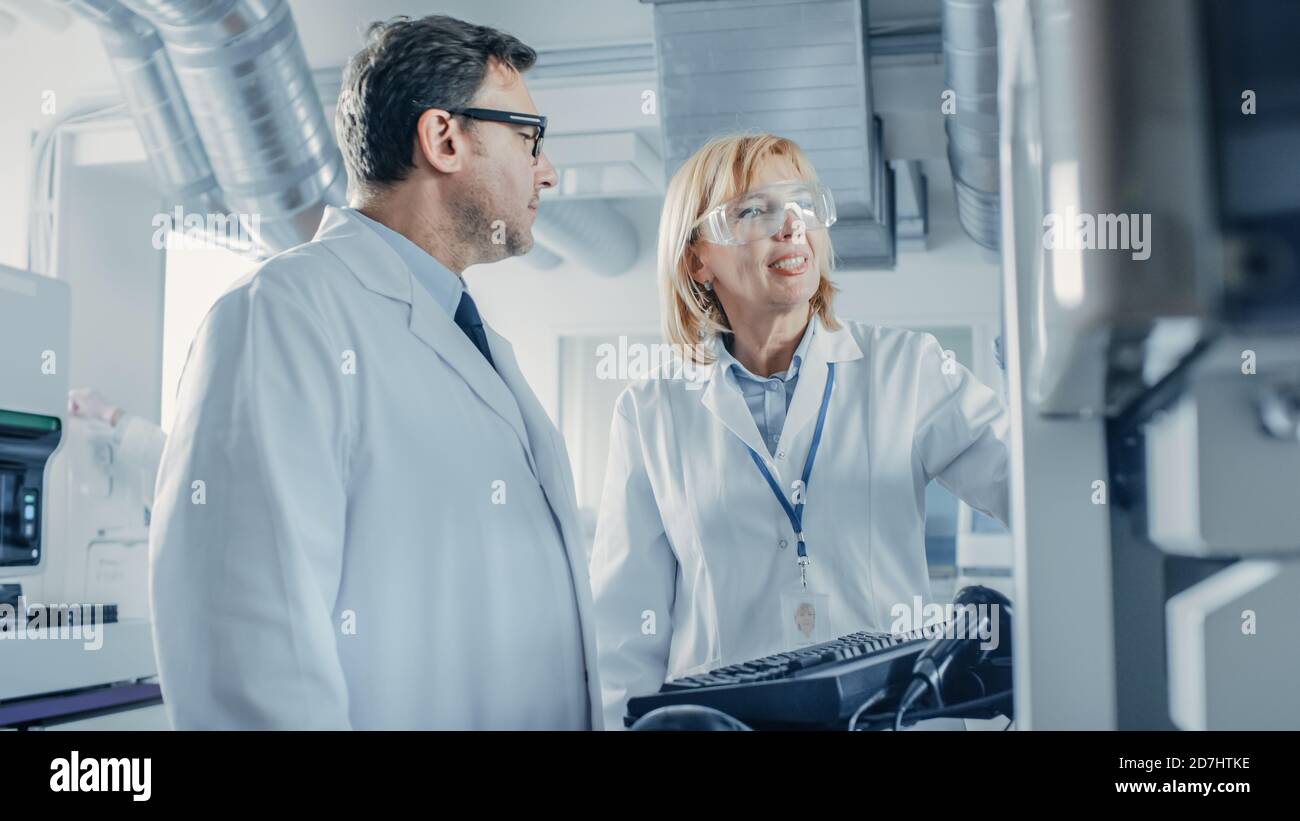 Modern research facility two scientists hi-res stock photography and ...