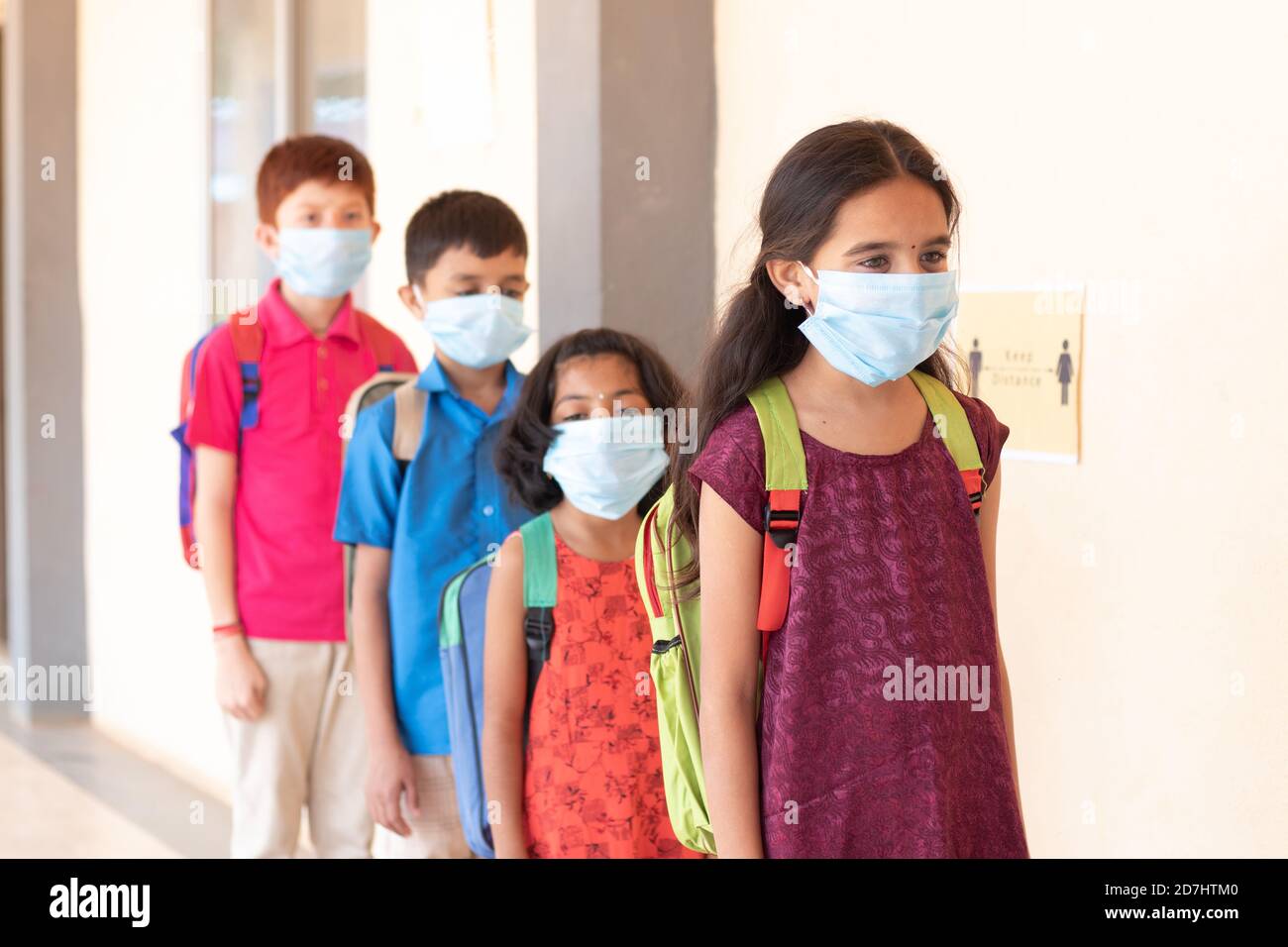 School childrens standing line in front of class while maintaining ...