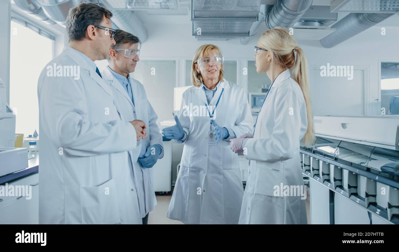 Team of Research Scientists Have Meeting, They Have Discussion While ...