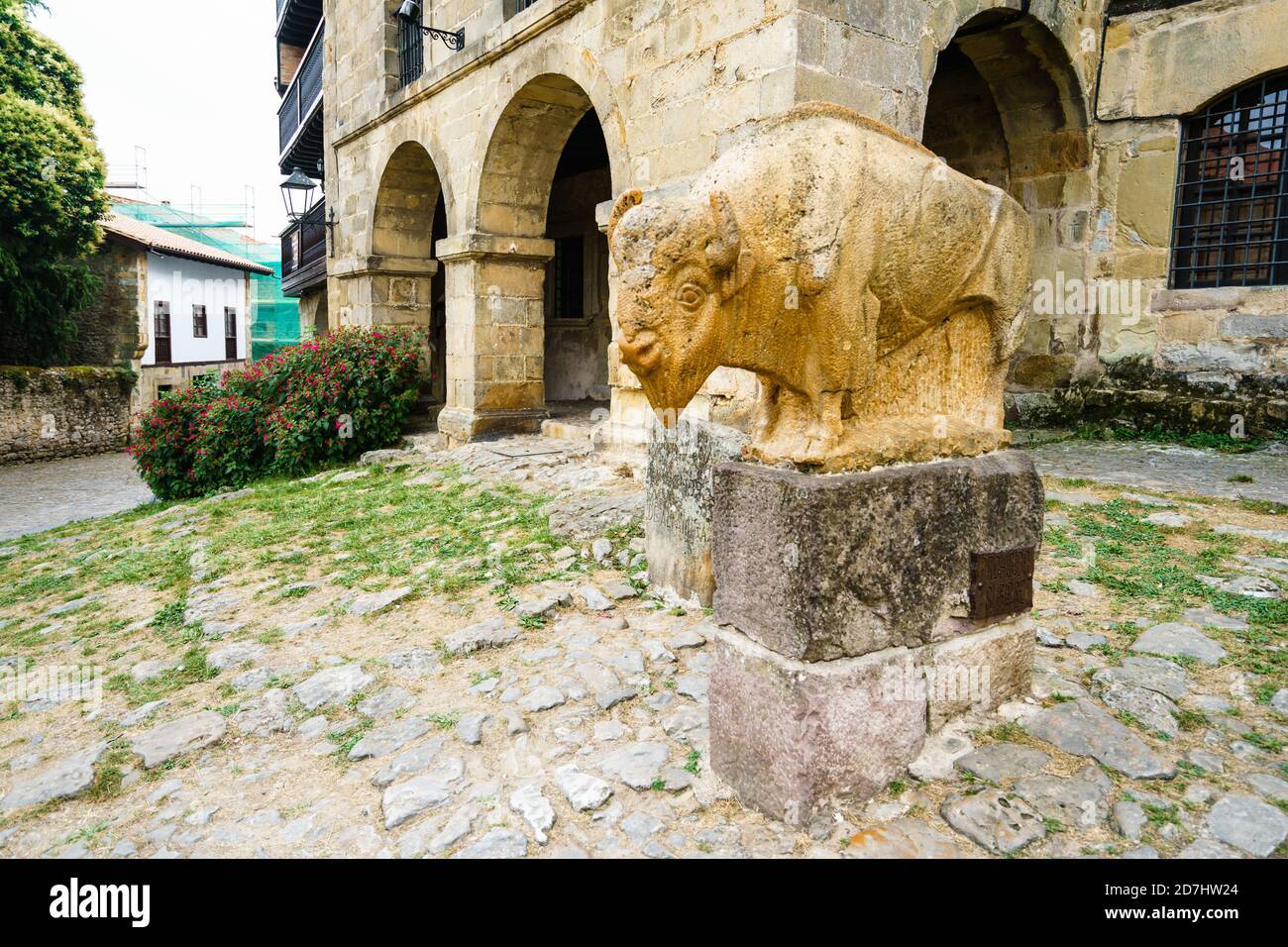 Golden stone bull monument in backyard in Santillana, Spain Stock Photo ...