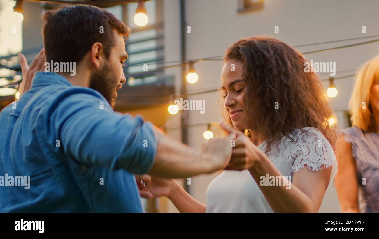Romantic Couple Dances Together with Group of Friends at the Garden ...