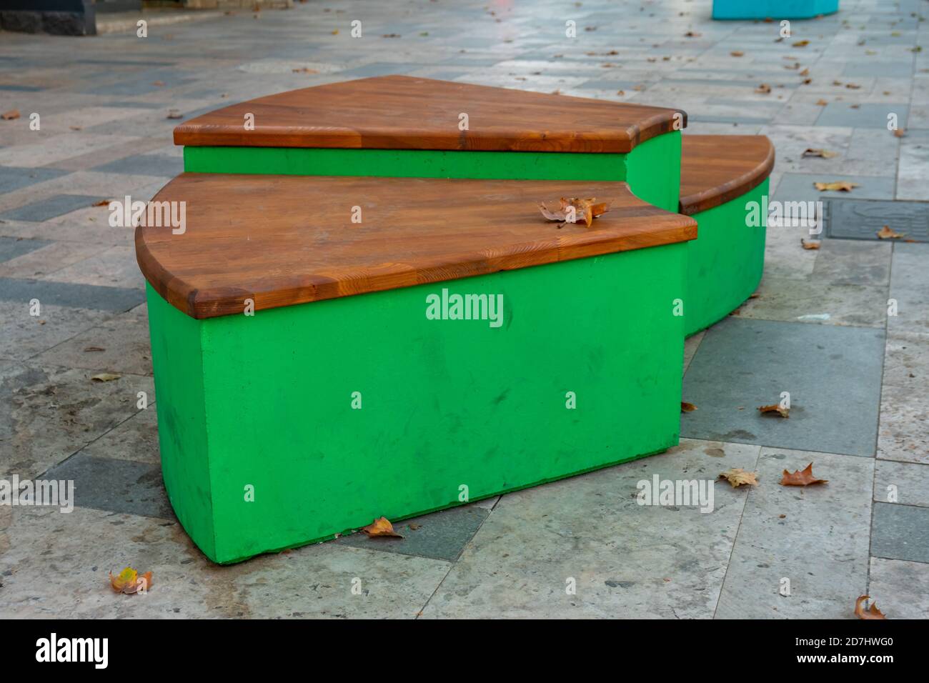 A modern bench with in a city park. City improvement, urban planning ...