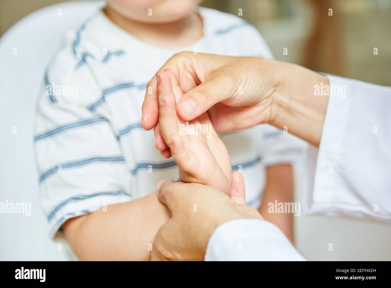 Child undergoing osteopathy or physiotherapy for wrist pain Stock Photo ...