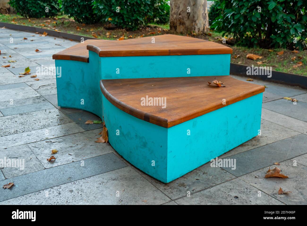 A modern bench with in a city park. City improvement, urban planning ...