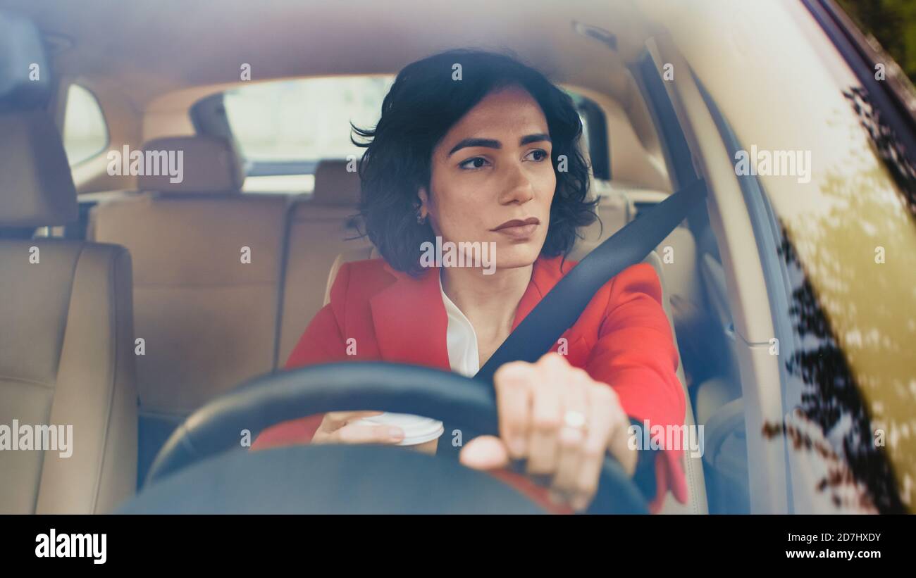 Portrait of Serious Beautiful Young Woman Driving Car through Sunny ...